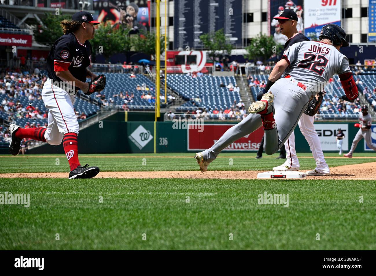 Cleveland Guardians' Nolan Jones (22) falls to ground after he was ...