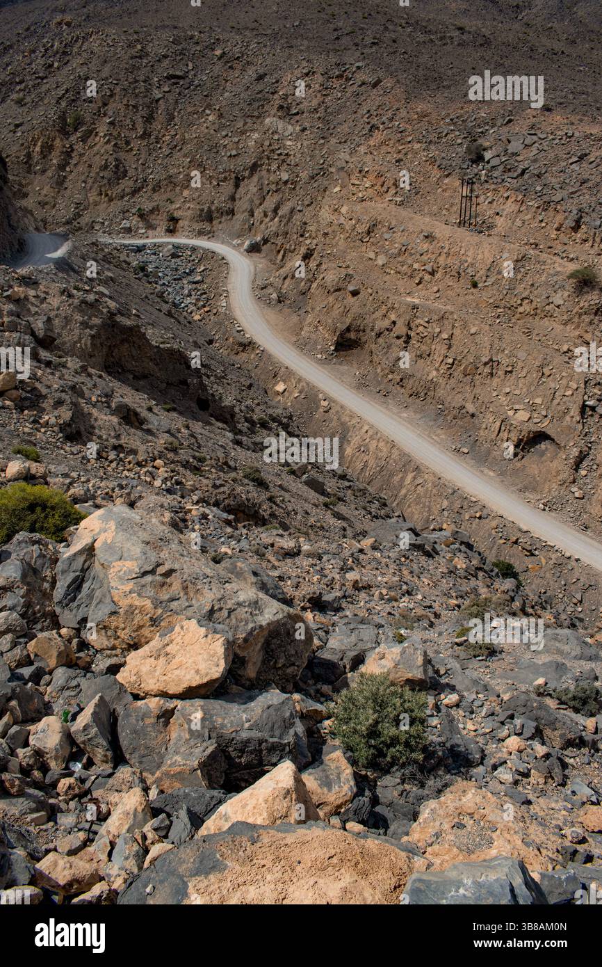 Oman: canyon and view of the winding road to Jebel Al Harim (Jabal Al ...