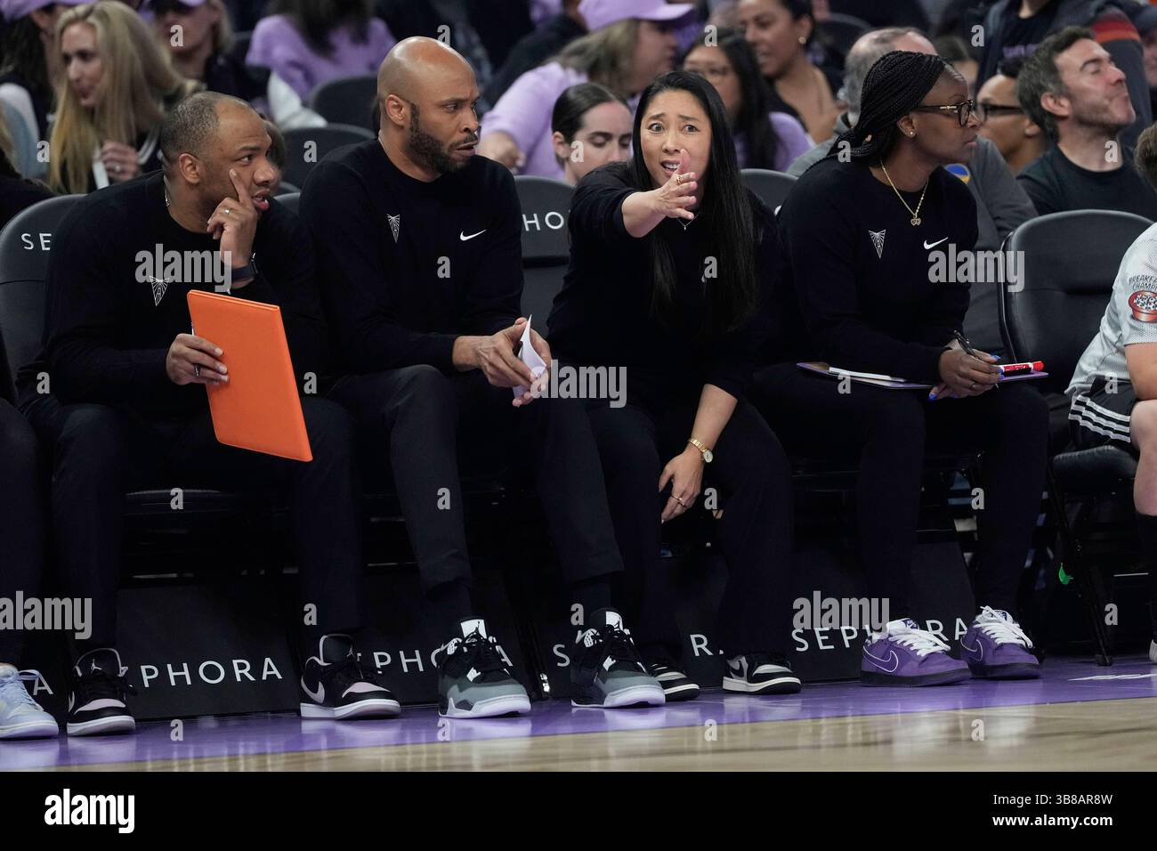 Golden State Valkyries head coach Natalie Nakase, middle right ...