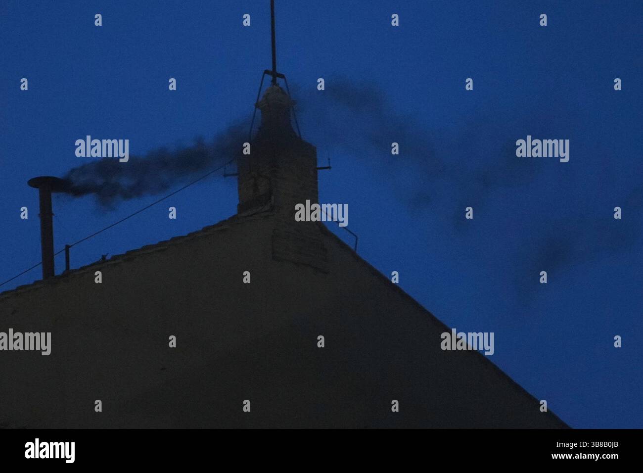 Black smoke billows from the chimney of the Sistine Chapel during the ...