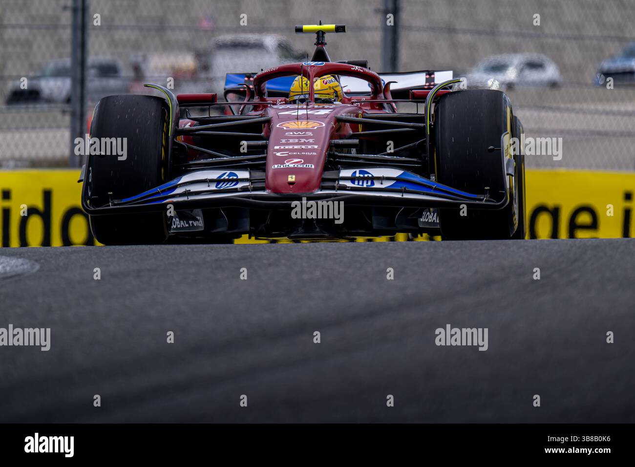 MIAMI, UNITED STATES: Lewis Hamilton, racing for the Ferrari team ...