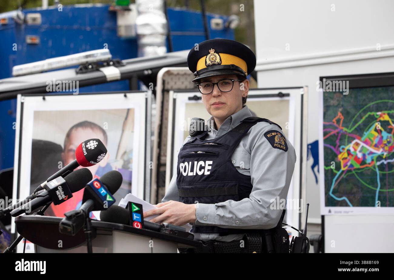 RCMP Cpl. Carlie McCann speaks to reporters about the search for six ...