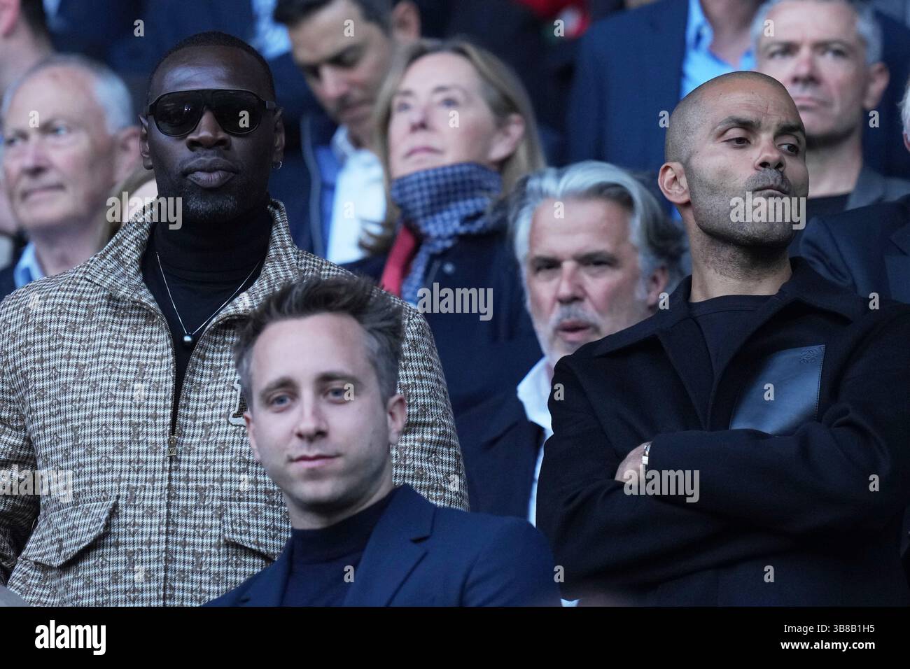 French actor Omar Sy, left, and former basketball player Tony Parker ...