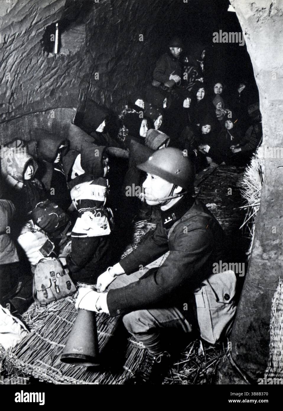 People in an air-raid shelter in Japan. From March 1945 the US Air ...