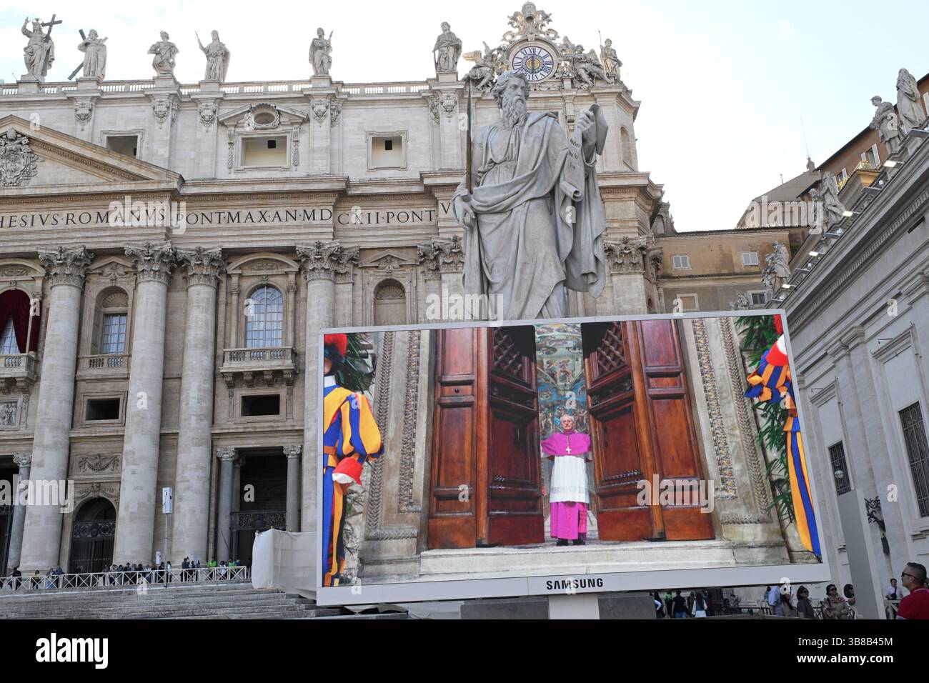A screen shows images of the cardinals before the start of the closed ...