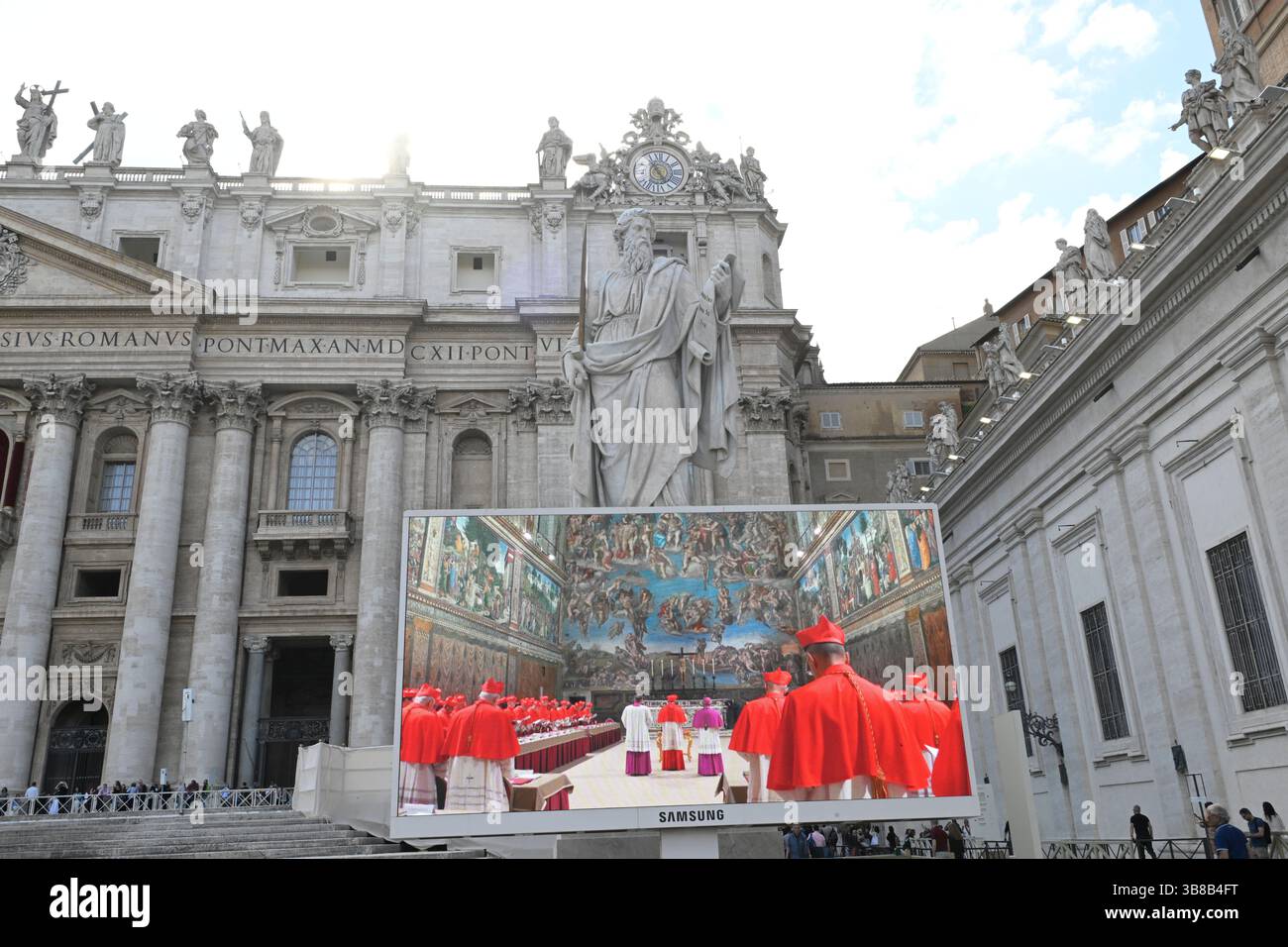 A screen shows images of the cardinals before the start of the closed ...
