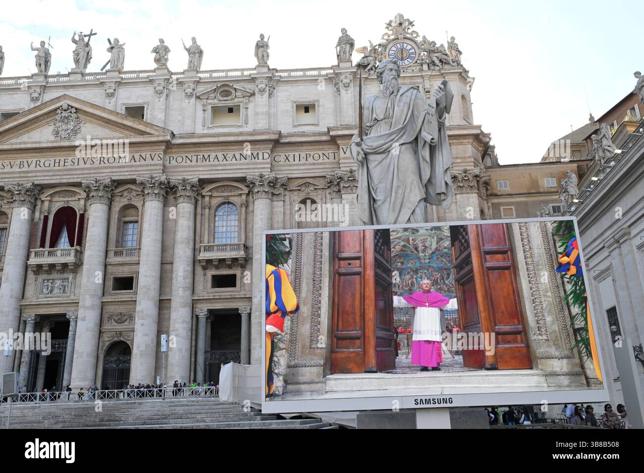 A screen shows images of the cardinals before the start of the closed ...