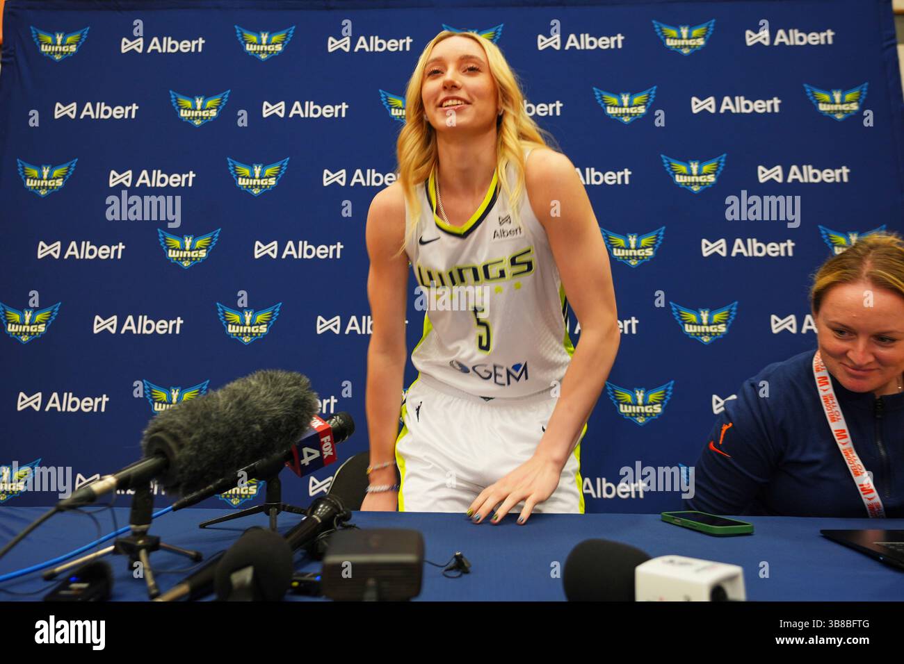 Dallas Wings guard Paige Bueckers (5) sits to speak to reporter during ...