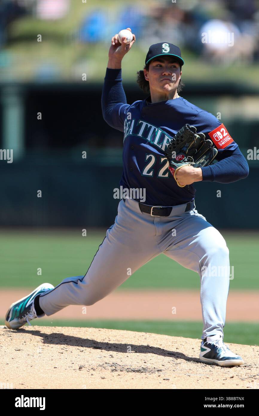 Seattle Mariners pitcher Bryan Woo throws a pitch to an Athletics ...
