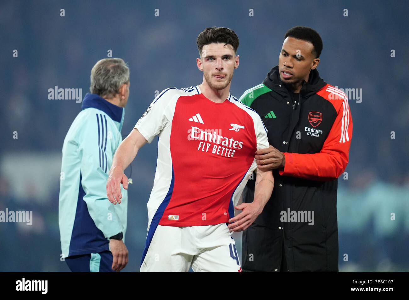 Arsenal's Declan Rice is consoled by team-mate Gabriel following defeat ...