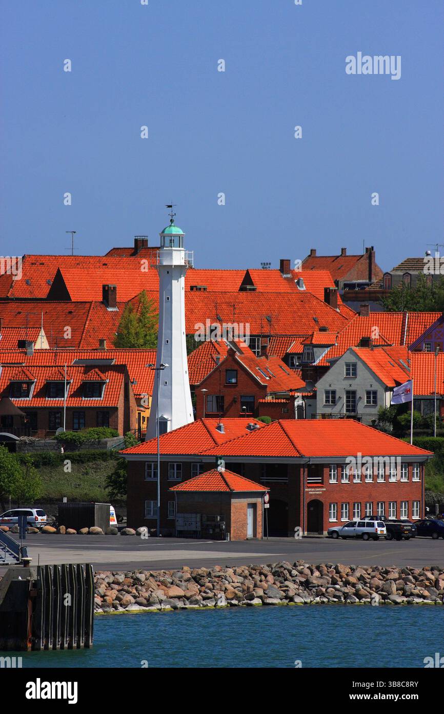 Denmark, Bornholm Island, Ronne. Lighthouse and red rooftops viewed ...