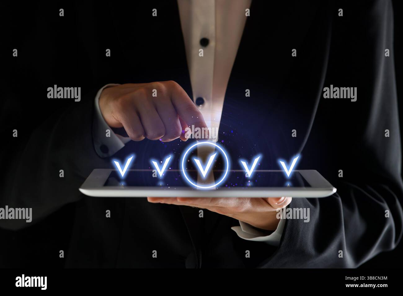 Approved. Man touching check mark on virtual screen above tablet ...