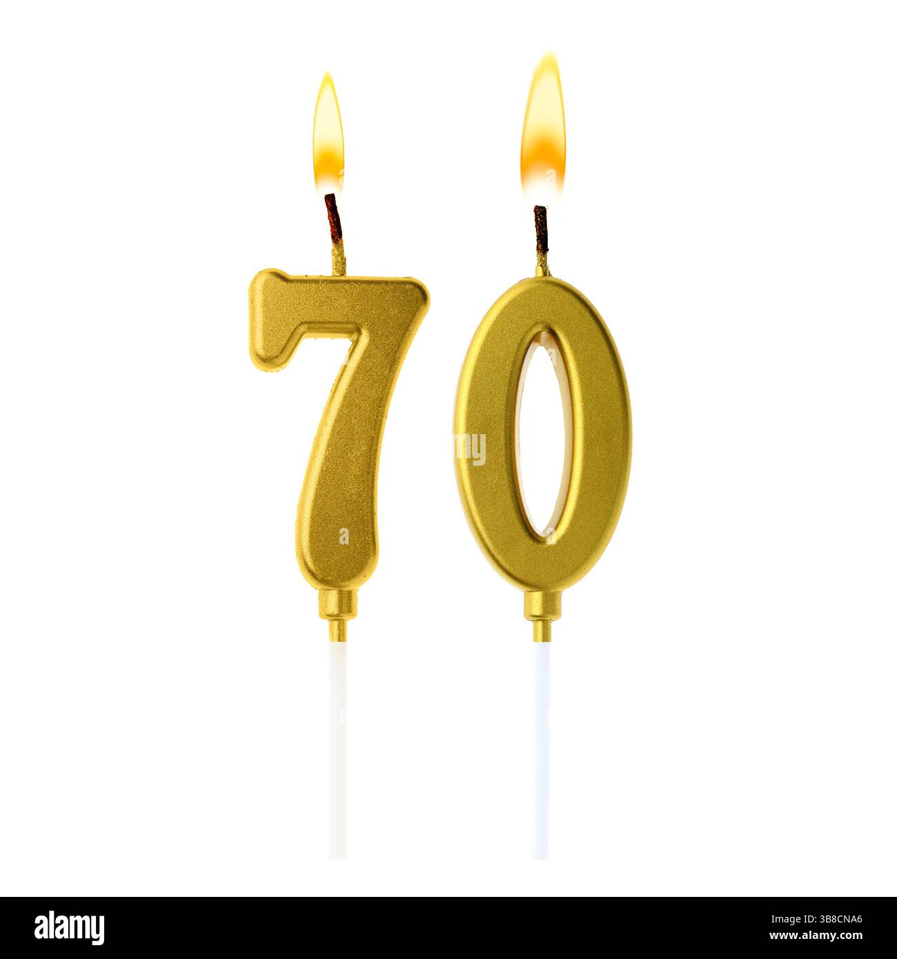 Burning golden cake candles composing number 70 on white background ...