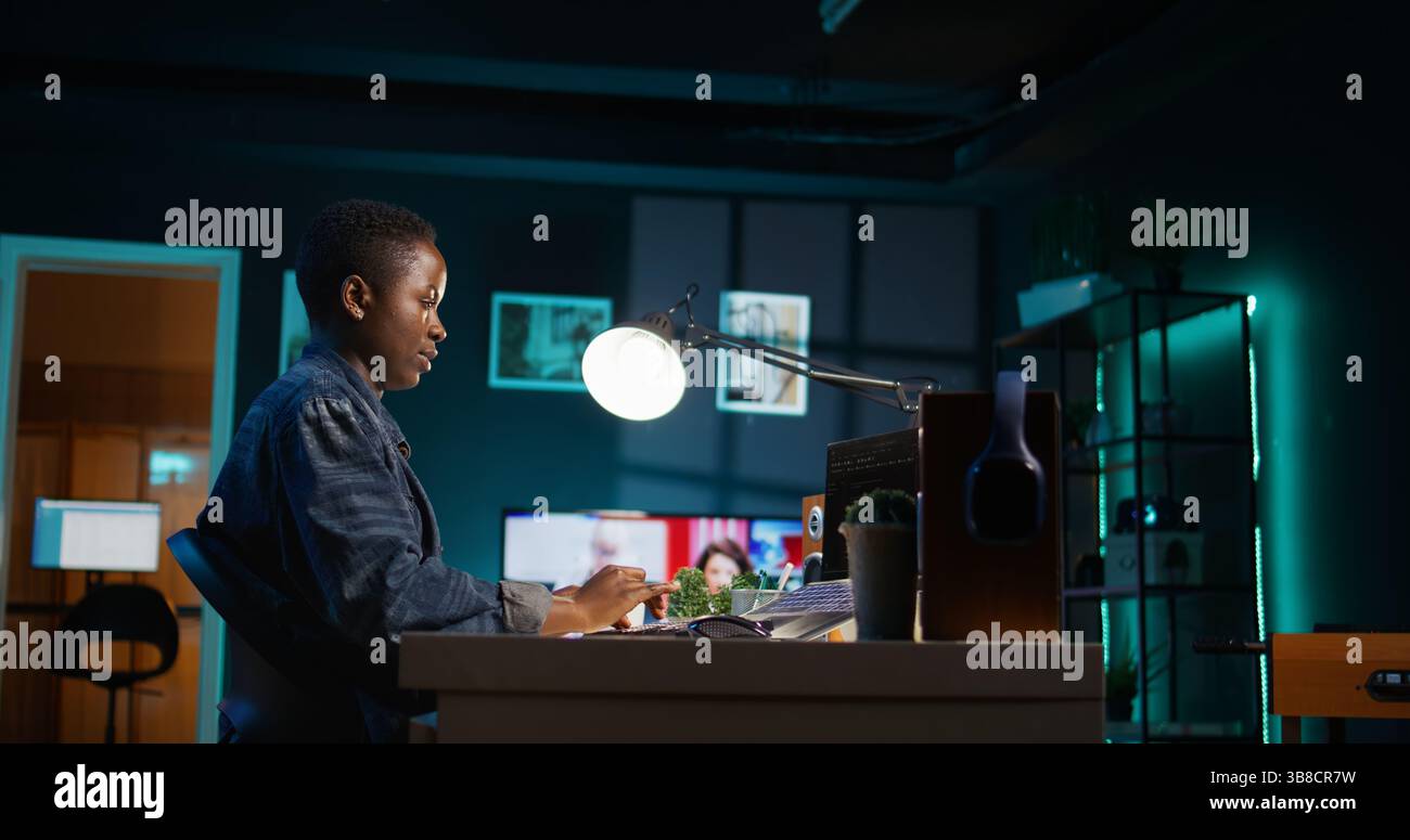 Freelancing admin in home office using laptop to write programming language code. Software ...