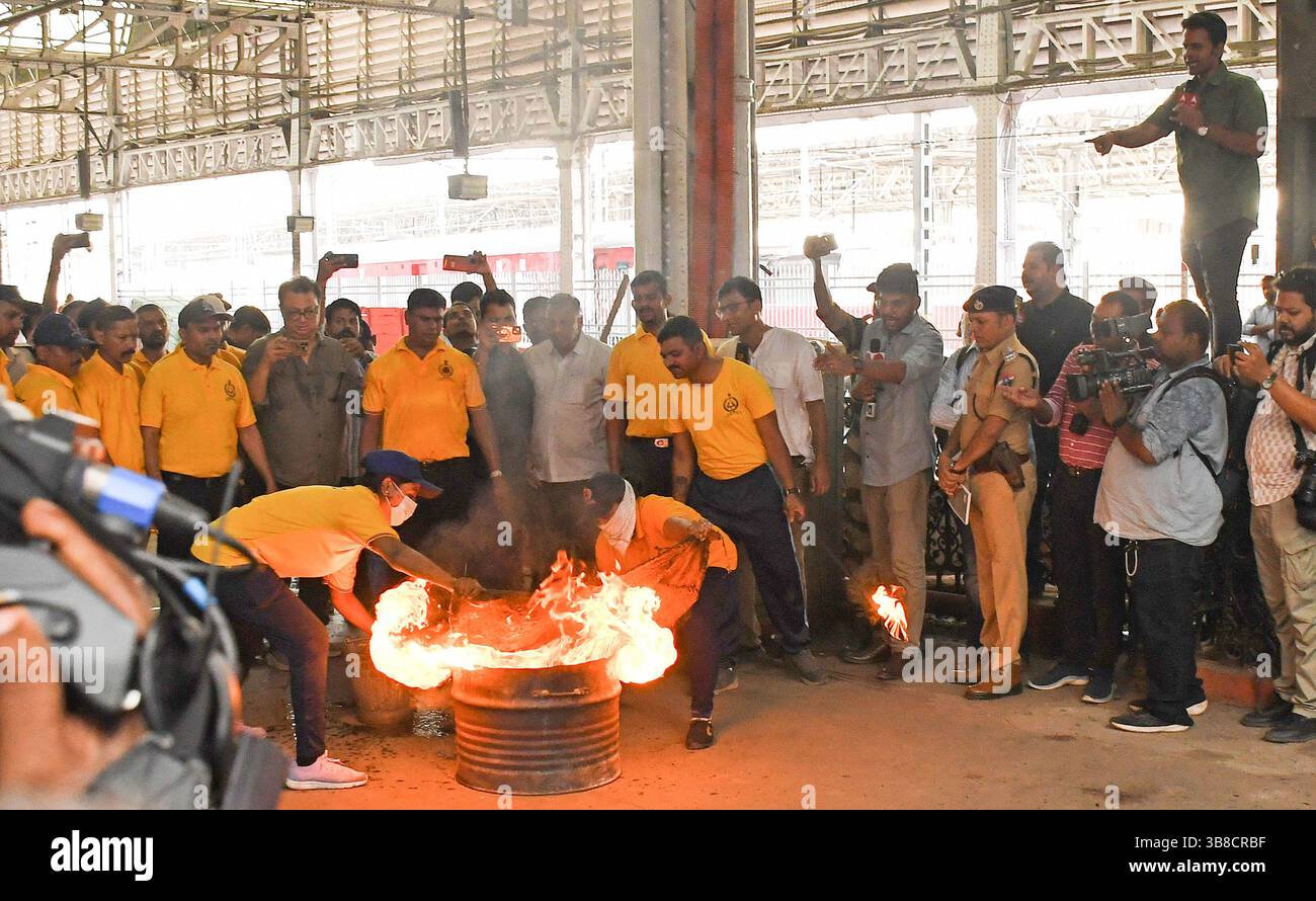 Members of civil defence team demonstrate a mock drill on how to ...