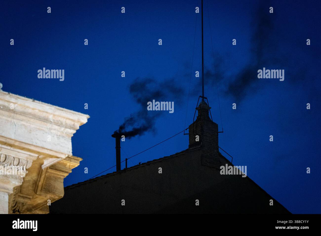 Vatican, Vatican. 07th May, 2025. Black smoke billows from the chimney ...