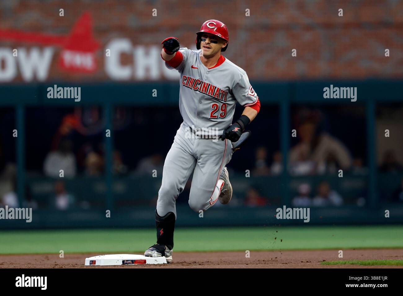 Cincinnati Reds' TJ Friedl reacts as he rounds second base after ...