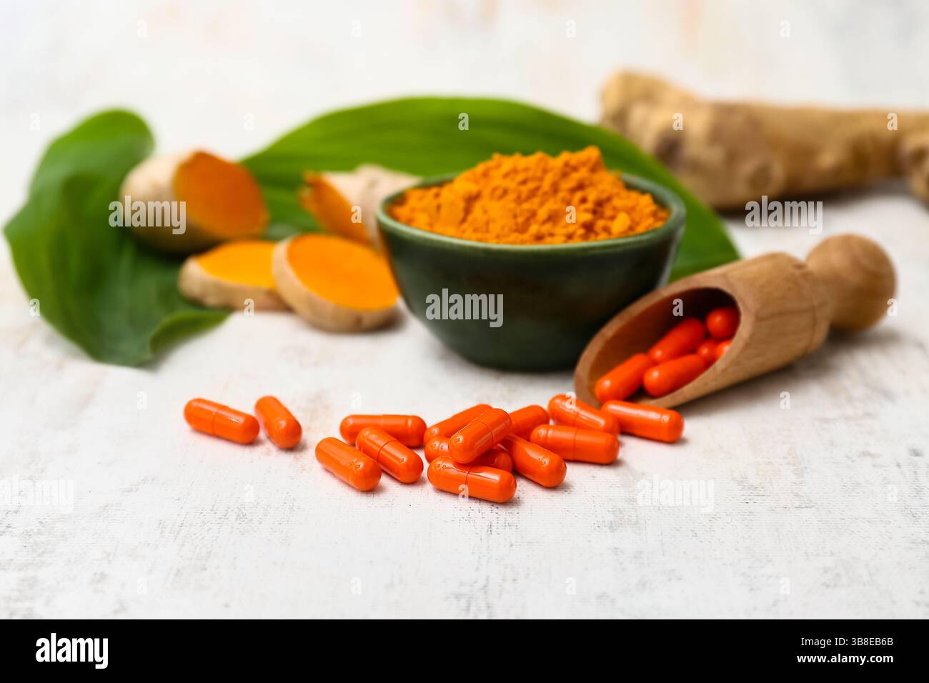 Turmeric pills and powder on white background Stock Photo - Alamy