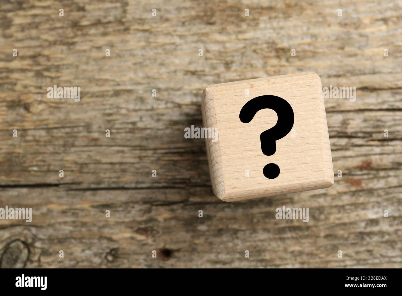 Wooden cube with question mark on table, top view. Space for text Stock ...
