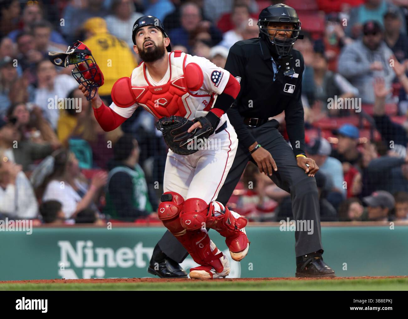 Boston Red Sox catcher Connor Wong chases a foul ball during the third ...