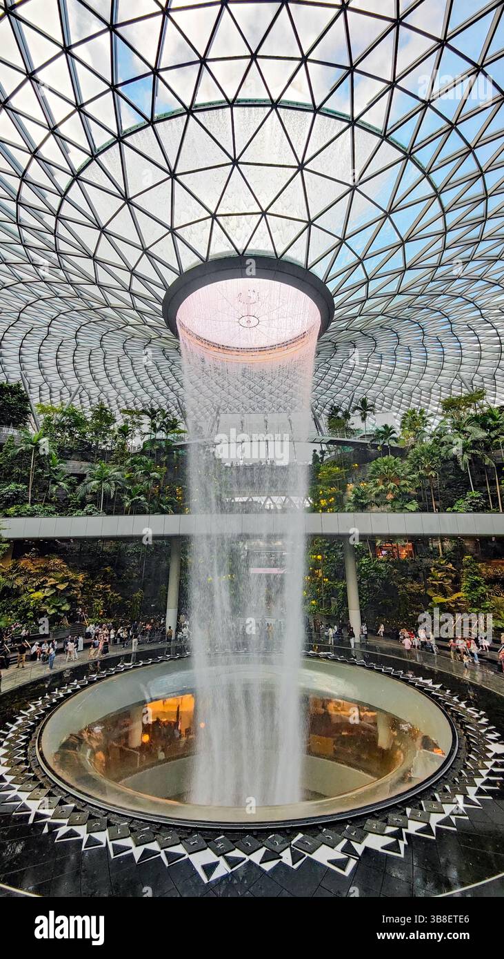 Singapore, 7 April 2025 : Parallax view of indoor Singapore rain vortex dome waterfall in rain ...