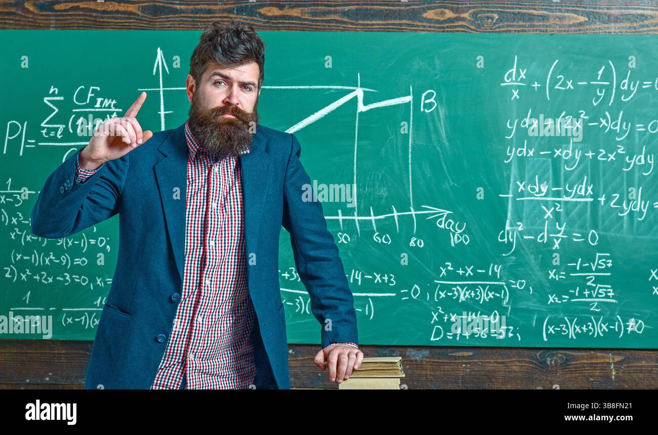 Teacher explains math in class. Professor in classroom on math lesson ...