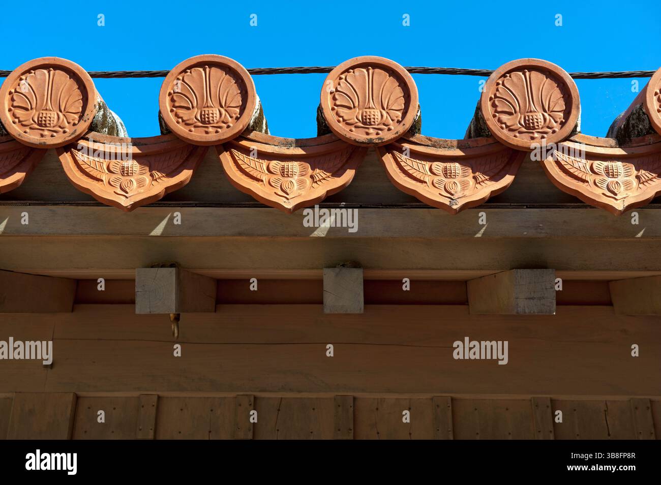 Ryukyu Kingdom Shuri Castle detail of roof eave overhang with ceramic ...