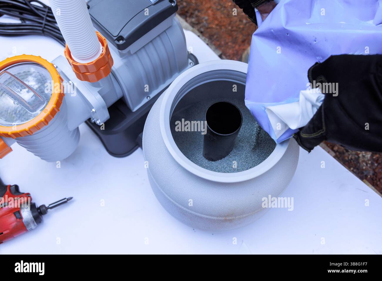 Assembling components of pool filtration system on works day in ...