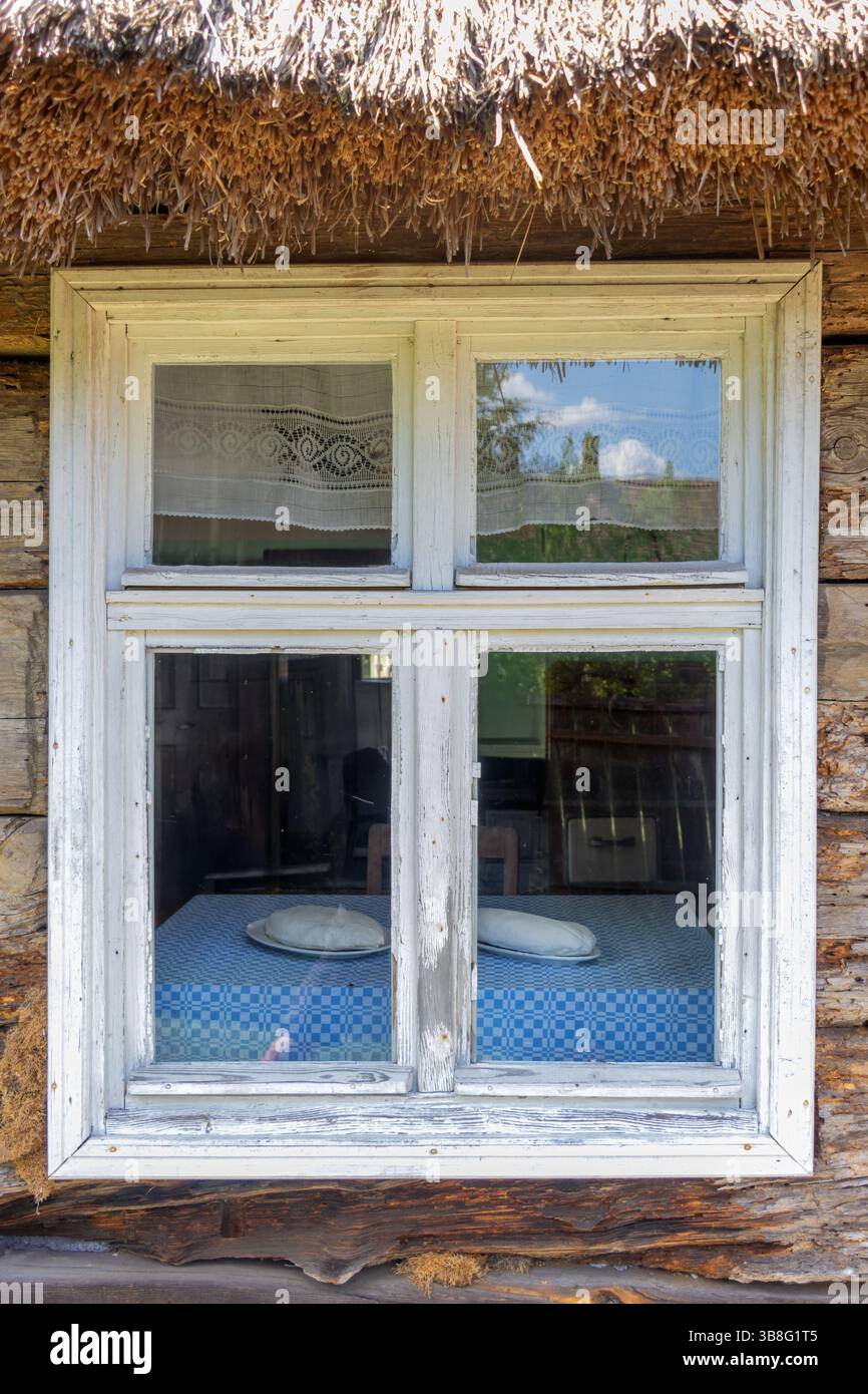 View through the window of an old village house on a table with rising ...