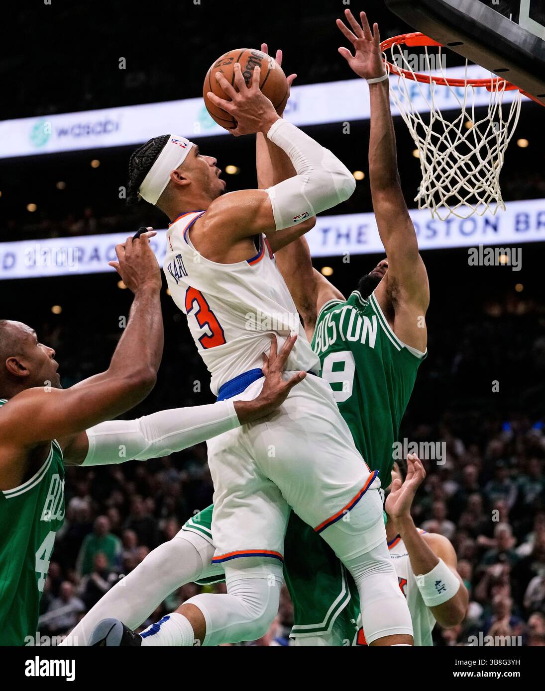 New York Knicks guard Josh Hart (3) shoots against Boston Celtics guard ...