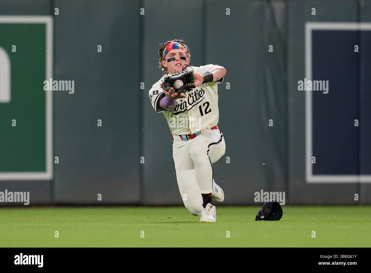 Minnesota Twins left fielder Harrison Bader (12) catches a line out hit ...