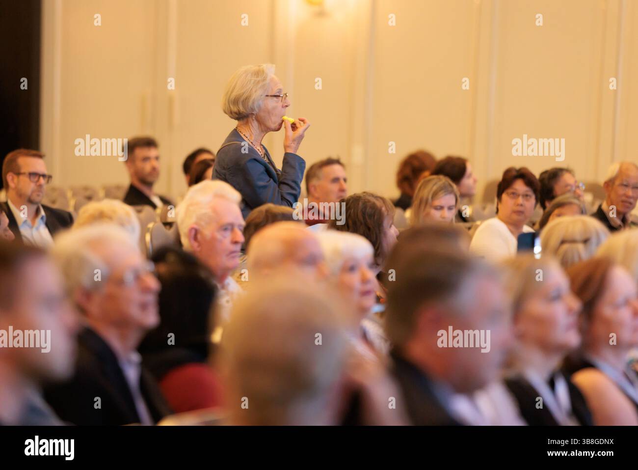 Perth, Australia. 08th May, 2025. A protester blows a whistle as CEO of ...