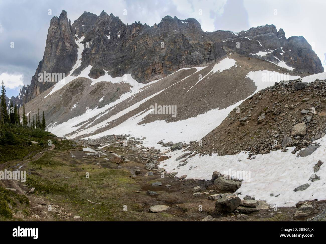 Stunning view of towering mountains with steep slopes and rocky terrain ...