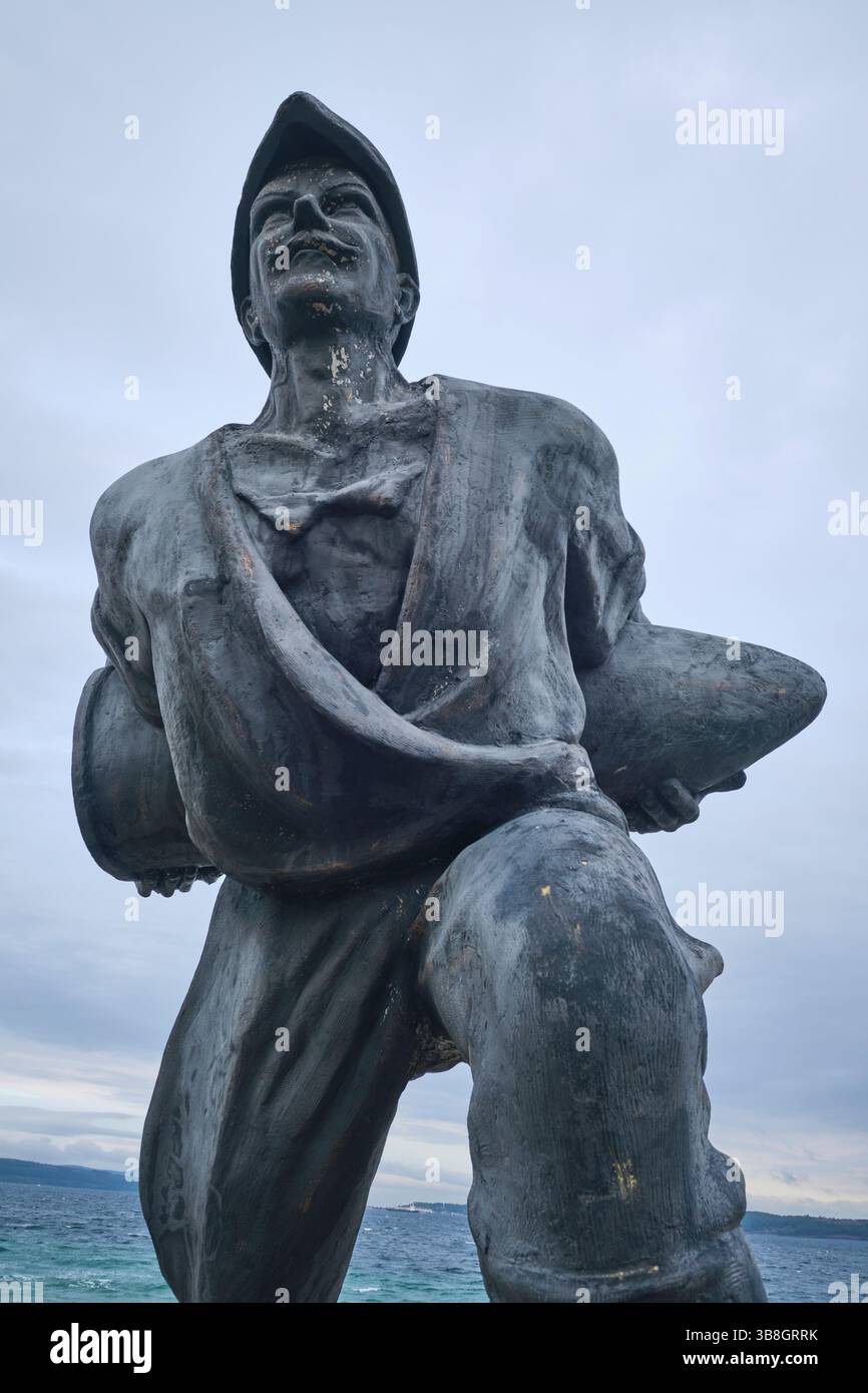 A rainy, grey, wet day view of the heroic sculpture by the strait.At ...