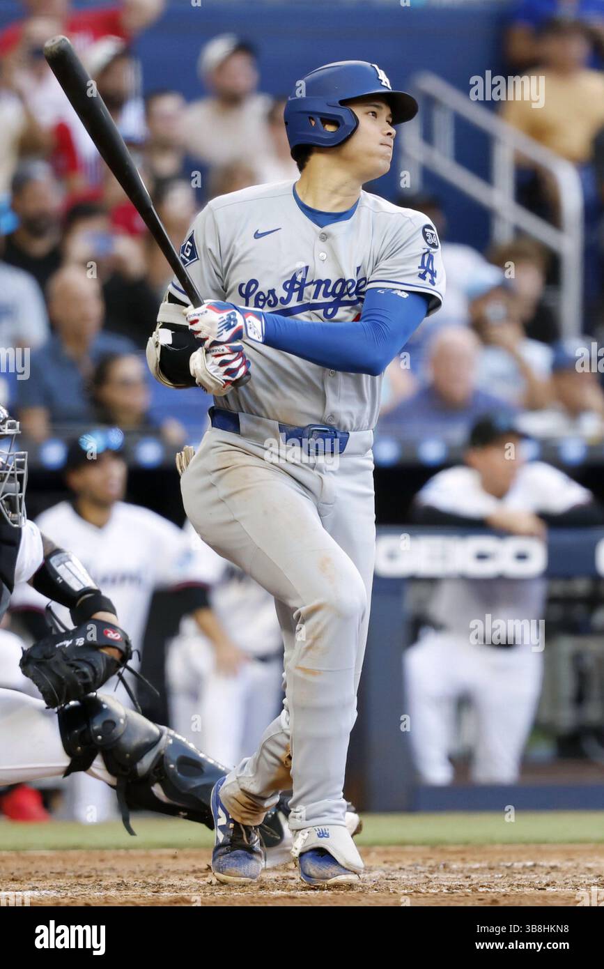 Los Angeles Dodgers designated hitter Shohei Ohtani hits a triple in ...