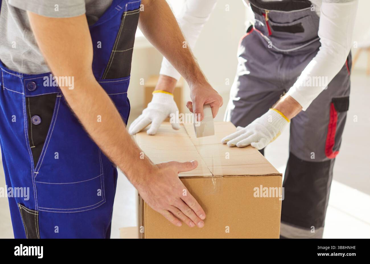 Delivery service men using scotch box lock packaging tape, shipping ...