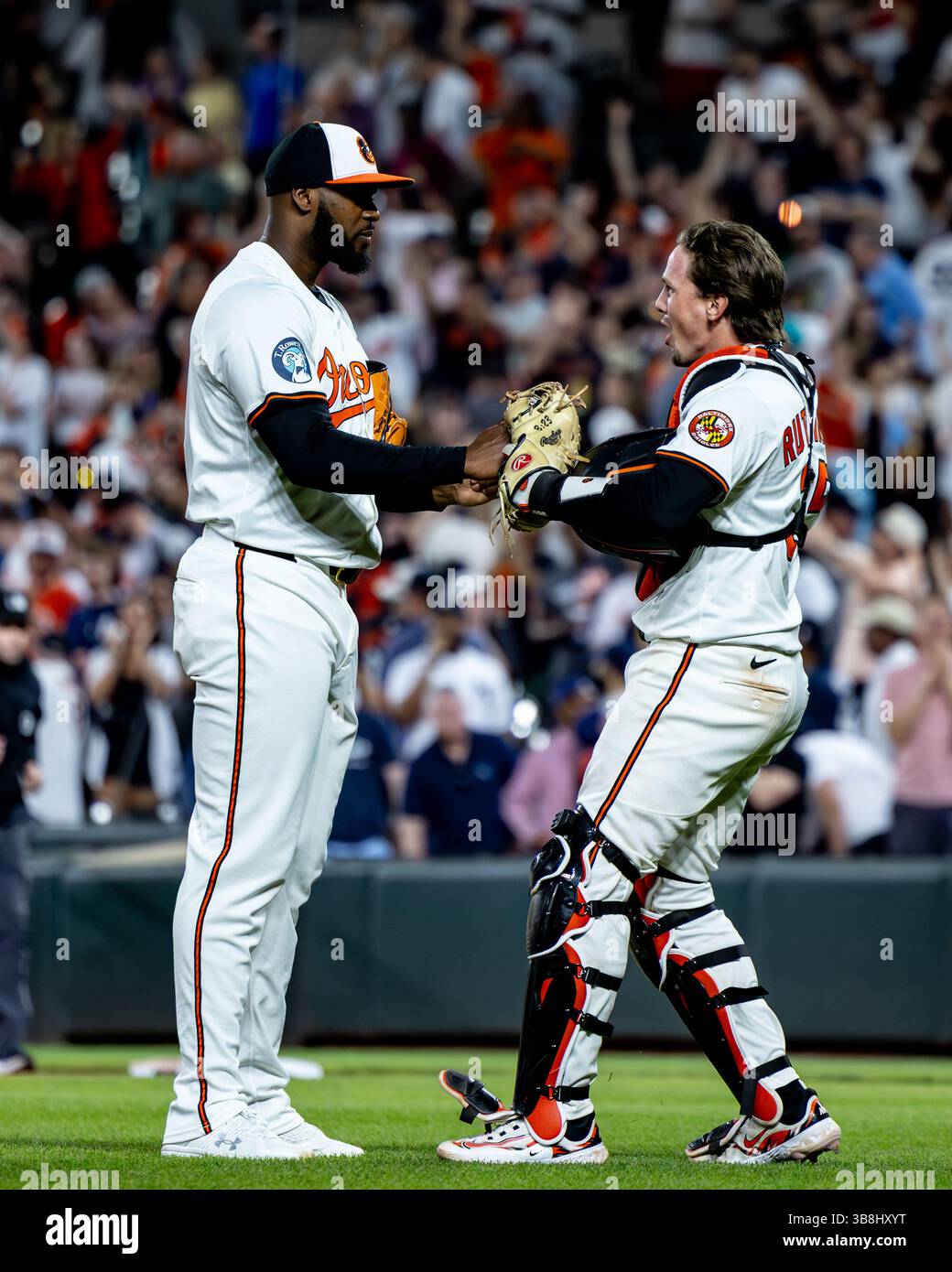 Baltimore Orioles relief pitcher Felix Bautista (left) and catcher ...
