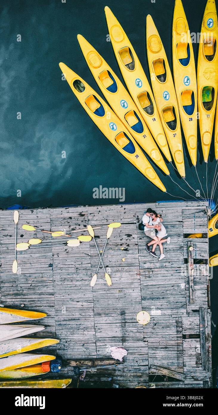 Aerial view of couple along the yellow kayaks in a blue waters Stock ...