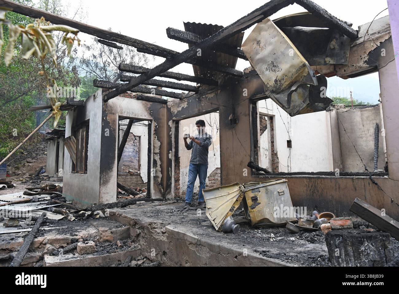 Uri, Jammu And Kashmir, India. 8th May, 2025. People inside a damaged ...