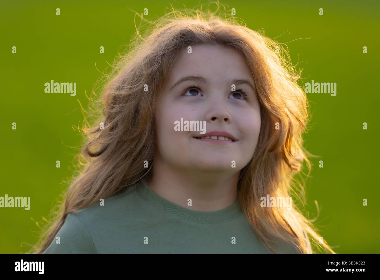 Kid looking away and thinking. Child dreamer thinking with a doubtful ...