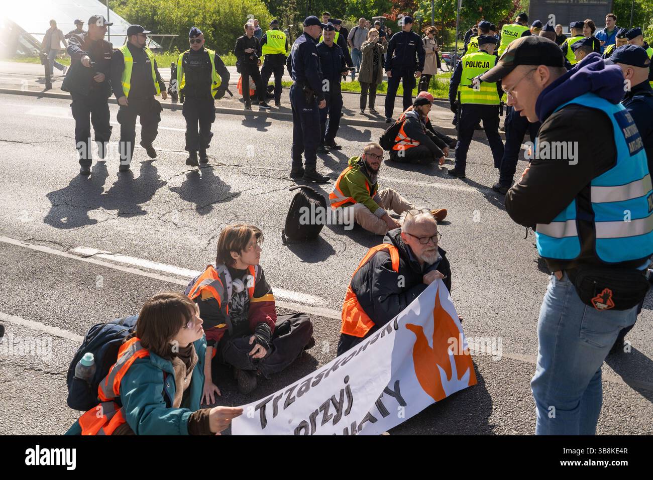 Climate activists blocking the road are confronted by the police. On ...