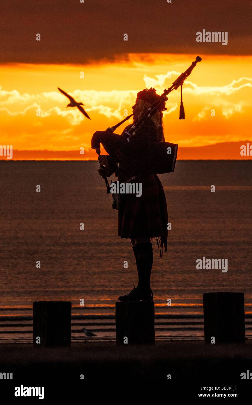 Scotland's National Piper Louise Marshall playing a lament to the ...