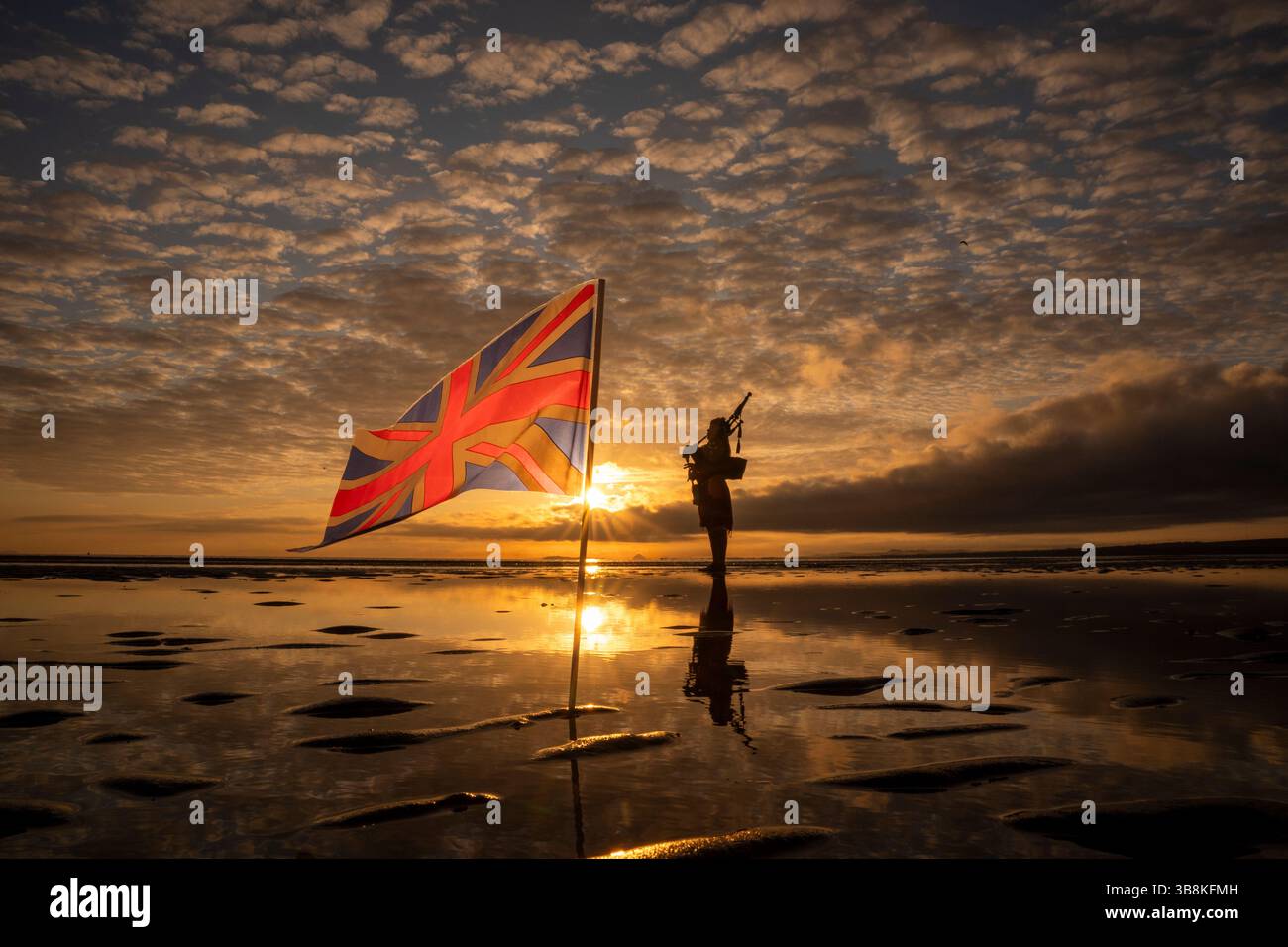 Scotland's National Piper Louise Marshall playing a lament to the ...