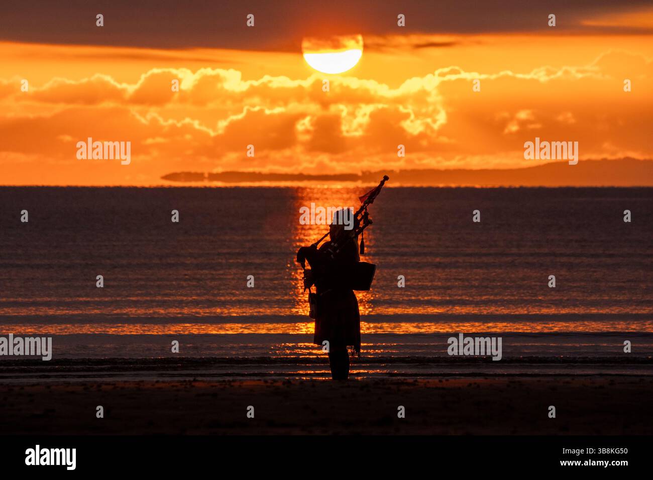 Scotland's National Piper Louise Marshall playing a lament to the ...