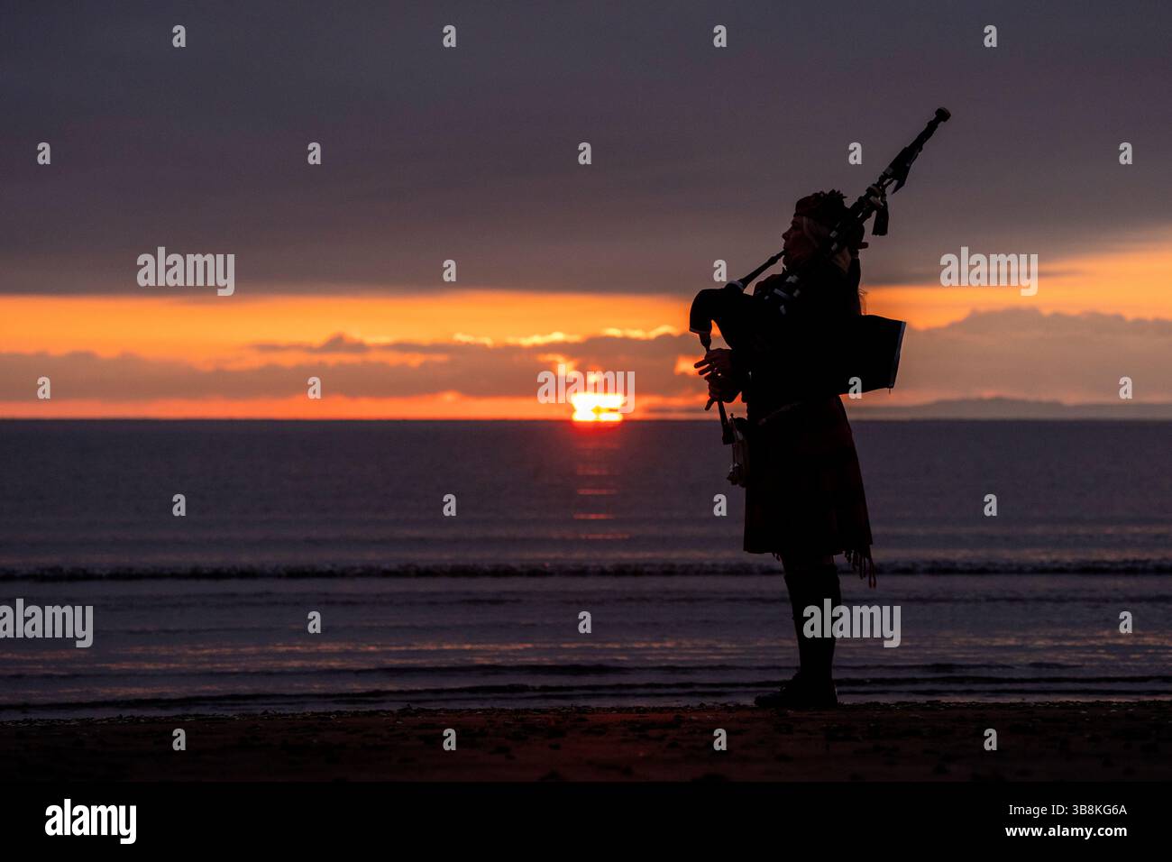 Scotland's National Piper Louise Marshall playing a lament to the ...