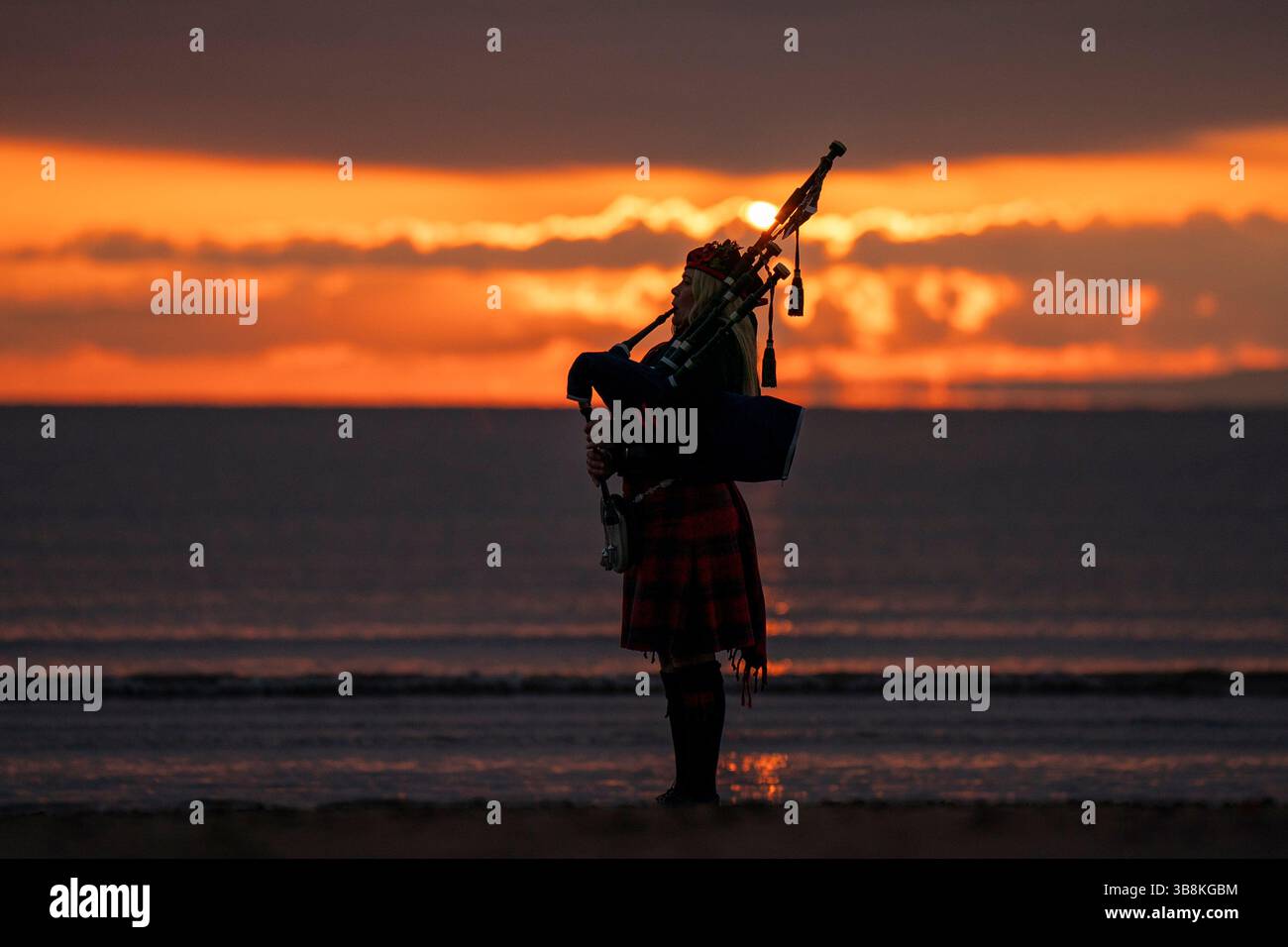 Scotland's National Piper Louise Marshall playing a lament to the ...