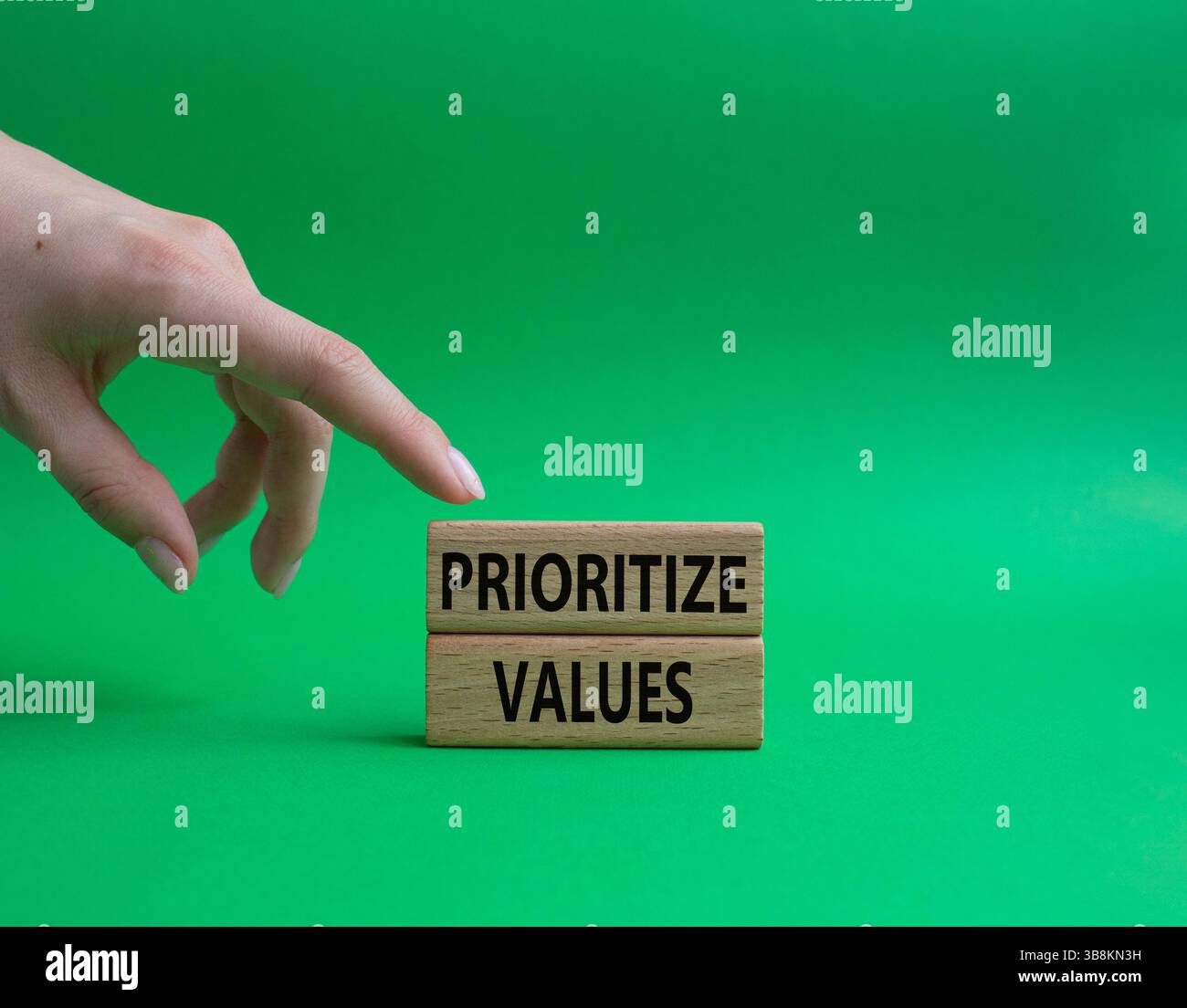Prioritize values symbol. Concept word Prioritize values on wooden ...