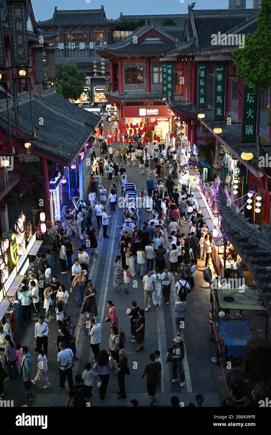 Tourists visit a scenic area during May Day holidays in Meishan City ...