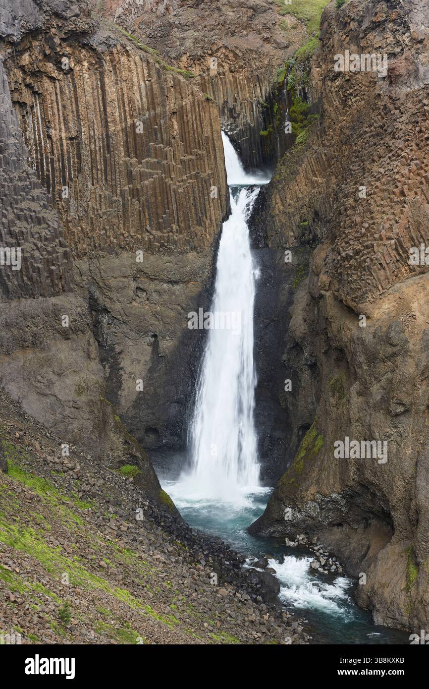 Picturesque Litlanesfoss waterfall and basaltic rocks. Lagarfljot. East ...