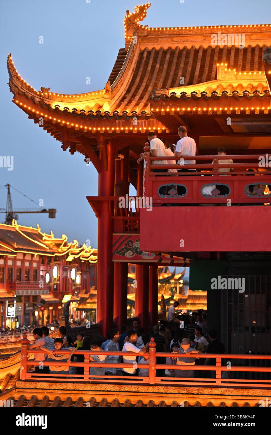 Tourists visit a scenic area during May Day holidays in Meishan City ...